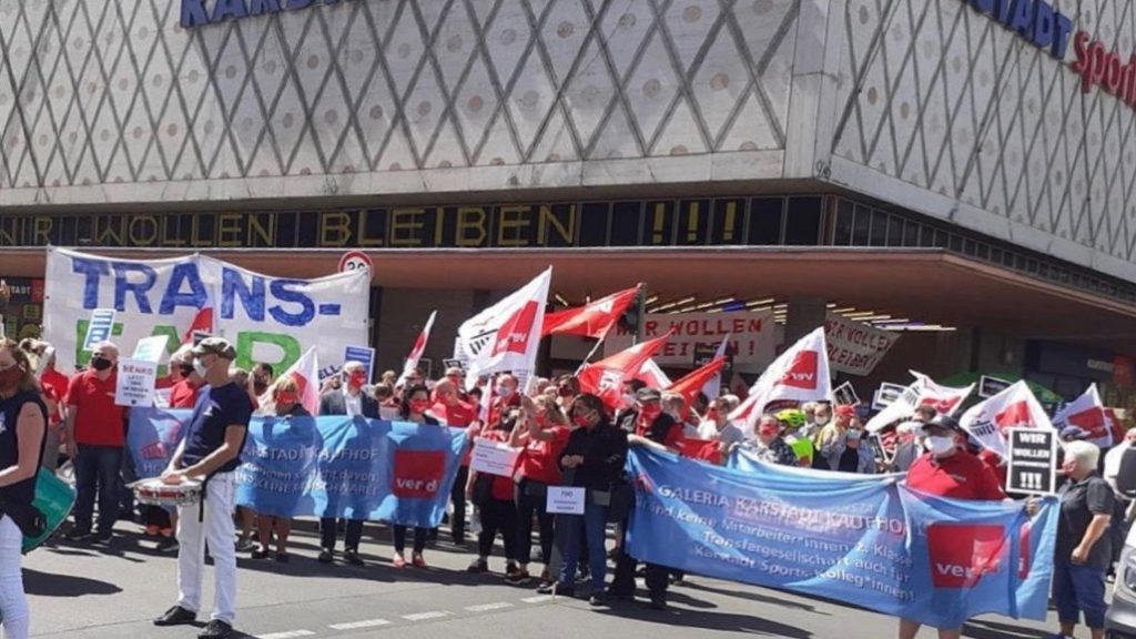 Workers march in Berlin protesting layoffs at major department store ...